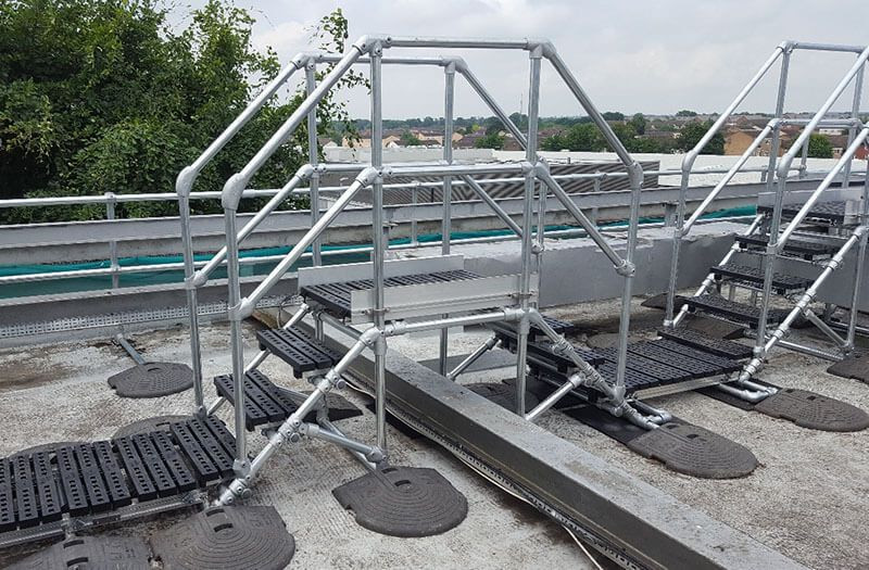 Stepover platforms for roof maintenance access - Simplified Safety