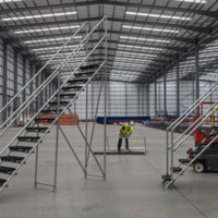 Large stepover unit to go over a conveyor belt - Simplified Safety