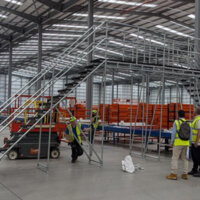 Large stepover unit to go over a conveyor belt - Simplified Safety