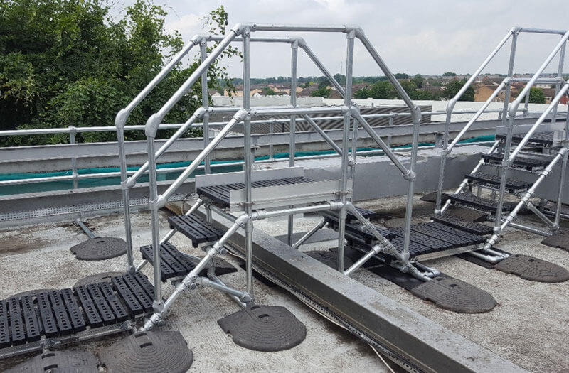 Stepover platforms for roof maintenance access - Simplified Safety